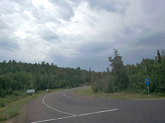 Rural intersections tell stories of journeys diverging and converging, with each directional sign pointing toward new Minnesota discoveries.