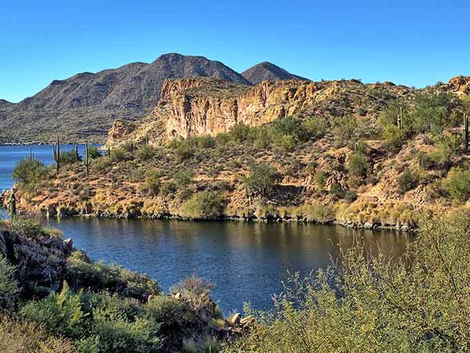 The lake stretches between mountains like nature decided to create the world's most beautiful swimming pool and forgot to charge admission for it.