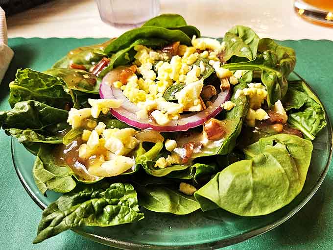 Fresh salad that actually looks appetizing, topped with ingredients that haven't given up on life like most restaurant greens.