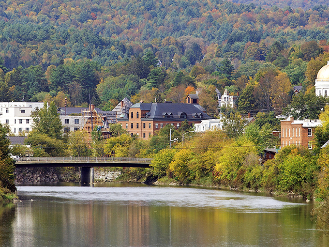 The Winooski River flows peacefully through Montpelier, creating a scenic backdrop for the capital city nestled among Vermont's rolling hills.