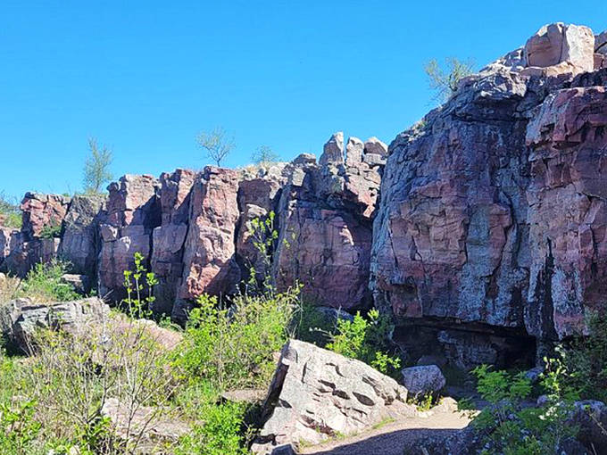 Towering rock walls create natural corridors through the quartzite landscape, inviting visitors to walk in the footsteps of countless generations.