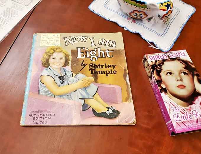 Shirley Temple memorabilia captures America's enduring fascination with the dimpled star who brightened Depression-era childhoods across the nation.