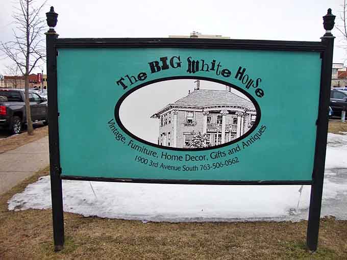 The iconic turquoise sign welcomes treasure hunters to The Big White House, where vintage furniture, decor, and gifts await discovery.