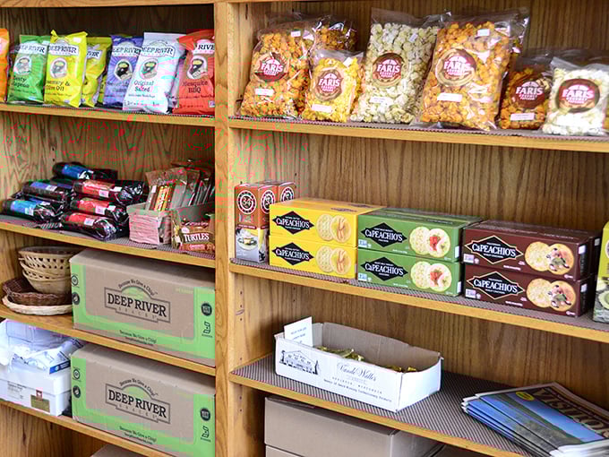 Beyond cheese: crackers, popcorn, and other perfect companions for your dairy adventure await on wooden shelves.