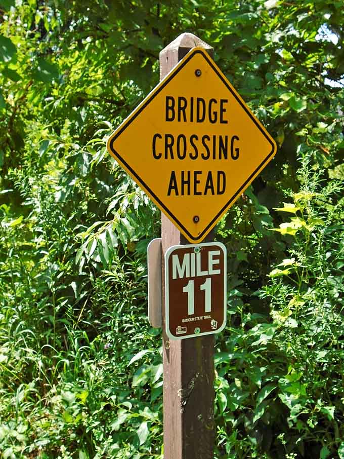 "Bridge Crossing Ahead" &ndash; trail markers serve as breadcrumbs through Wisconsin's backyard wilderness adventure.