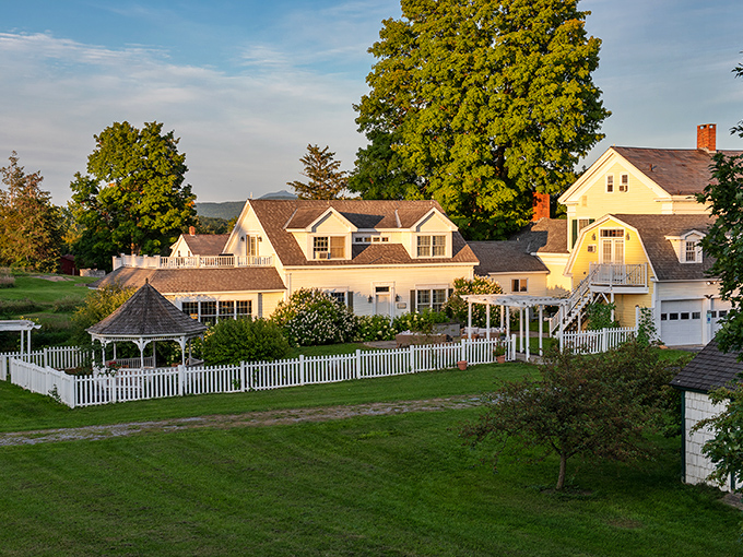 Strong House Inn welcomes visitors with classic New England charm, its white clapboard exterior promising comfort wrapped in historical elegance.