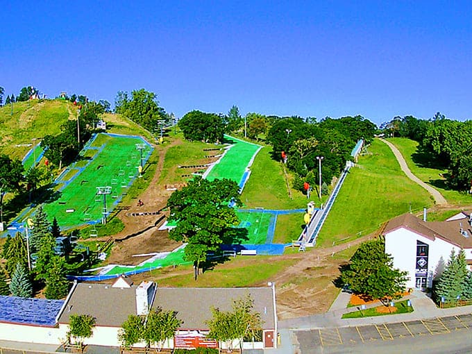 Summer reveals the hill's true contours, those green slopes just waiting for winter to work its transformative magic again.