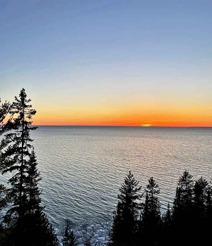 Sunset over Lake Michigan paints the sky in impossible colors, a daily masterpiece that never gets old.