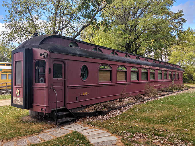 The stately Imperial Car offers a sophisticated retreat with its deep plum exterior and beautifully preserved architectural rail details.