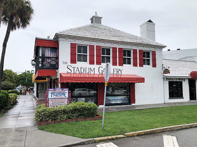 The Stadium Gallery's distinctive red shutters and colonial architecture offer a striking contrast to the contemporary art treasures housed within.