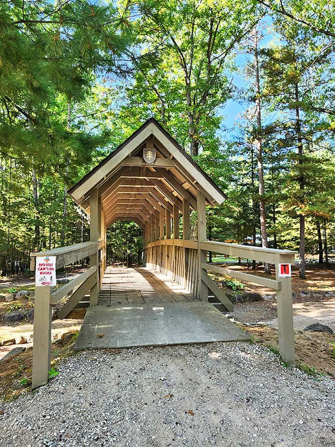 Covered bridge pathway leading to adventure &ndash; crossing this means leaving behind emails, meetings, and reality TV.