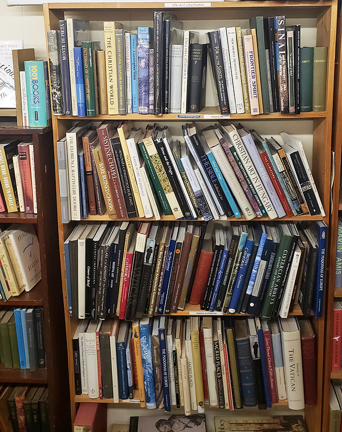 Christian literature and theological texts fill these shelves, offering spiritual seekers everything from devotionals to scholarly biblical commentaries.