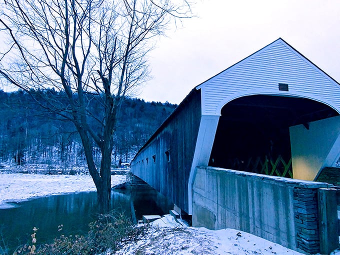 Winter transforms the Cornish-Windsor Bridge into a snow-dusted passage between states, equally beautiful in every season.