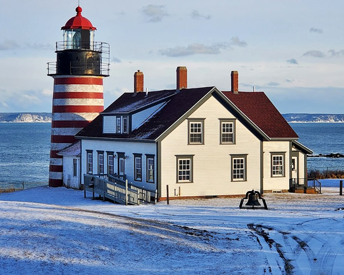 Winter's embrace: Snow transforms the lighthouse into a scene from a New England fairy tale, worth every shiver to experience.