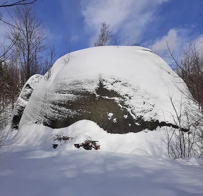 Winter transforms Daggett Rock into a snow-capped monument, its massive form somehow more dramatic when blanketed in pristine white.