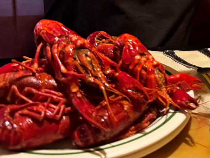 Weekend dinner service sometimes features these spicy crawfish, their bright red shells signaling the flavor punch waiting inside.