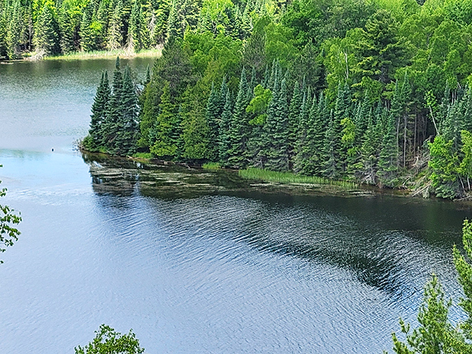 Nature's own infinity pool effect, where the blue water seems to merge with the horizon in a seamless display of Michigan magic.