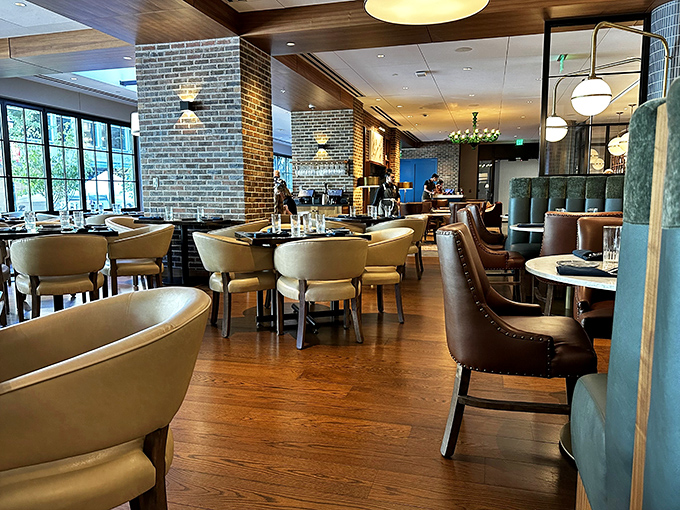 Comfortable elegance defines the dining room, where warm wood tones and strategic lighting create the perfect backdrop for culinary exploration.