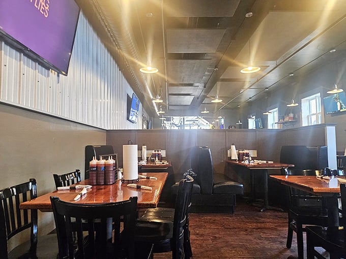 Rustic tables bathed in natural light create the perfect stage for the smoky drama about to unfold on your plate.