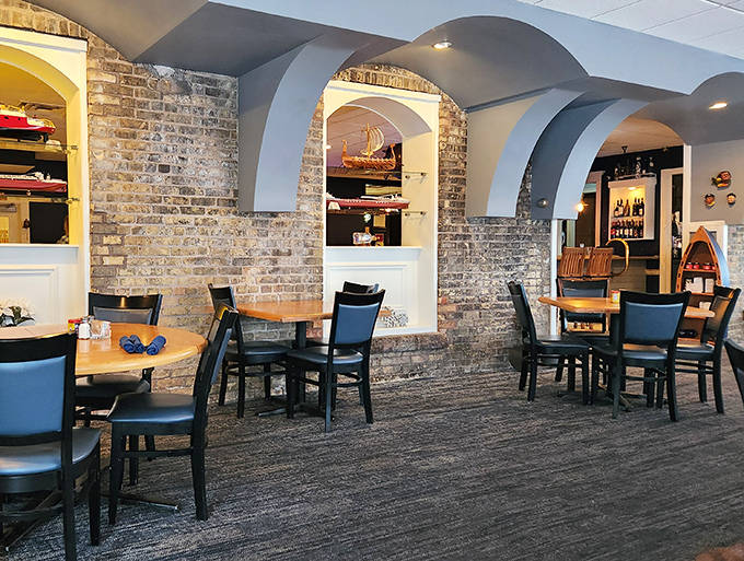 Rustic brick walls and thoughtful lighting create dining nooks where conversations flow as easily as the wine.