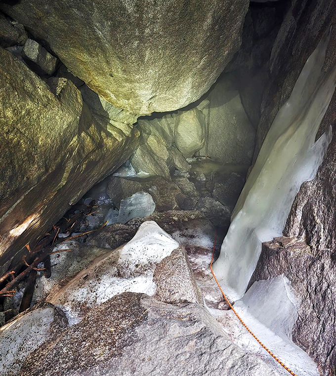 Ice formations catch light in spectacular fashion, revealing blue hues that seem to glow from within the compressed ancient ice.