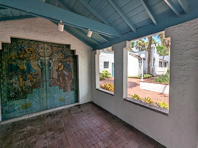 Vibrant painted doors tell ancient stories in modern colors, a portal between worlds hiding in plain sight.