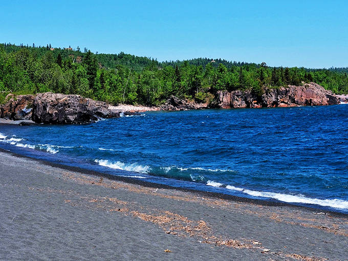 Autumn paints Black Beach in fiery hues, complementing the shoreline's natural color palette with seasonal splendor.