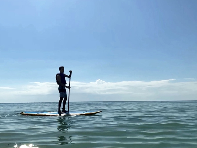 Stand-up paddleboarding offers a unique vantage point of the wreck below. Time-travel and core workout in one convenient package!