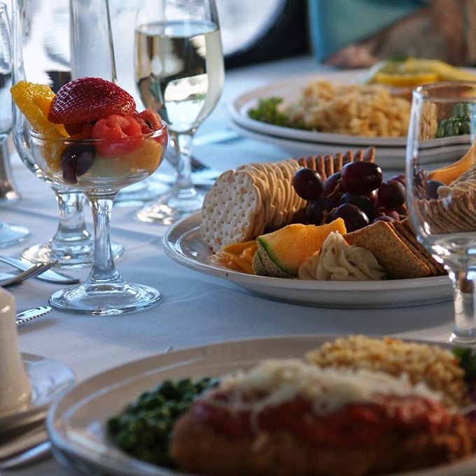 The dining car transforms into a rolling restaurant, where fine food and panoramic views compete for attention with the unfolding mystery.