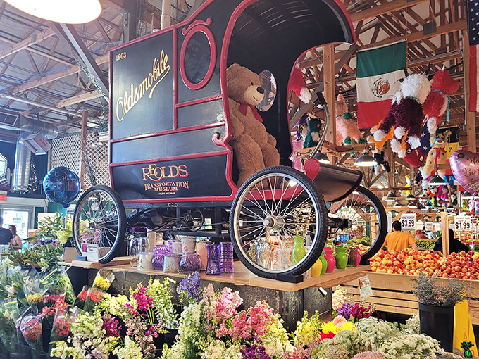 Vintage charm meets fresh produce as this antique delivery wagon reminds shoppers of simpler times amid modern abundance.