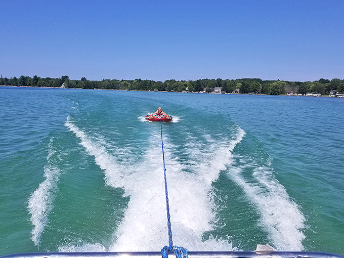 Adrenaline meets beauty as water sports enthusiasts find their playground. The lake's expansive surface provides perfect conditions for aquatic adventures.