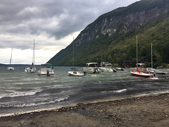 When the wind picks up, the lake transforms from mirror to dance floor, with waves that make boats bob like they're enjoying the music.