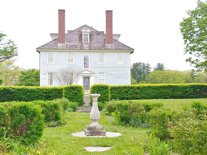 The formal gardens near Hamilton House offer a manicured contrast to the wilder woodland trails beyond.
