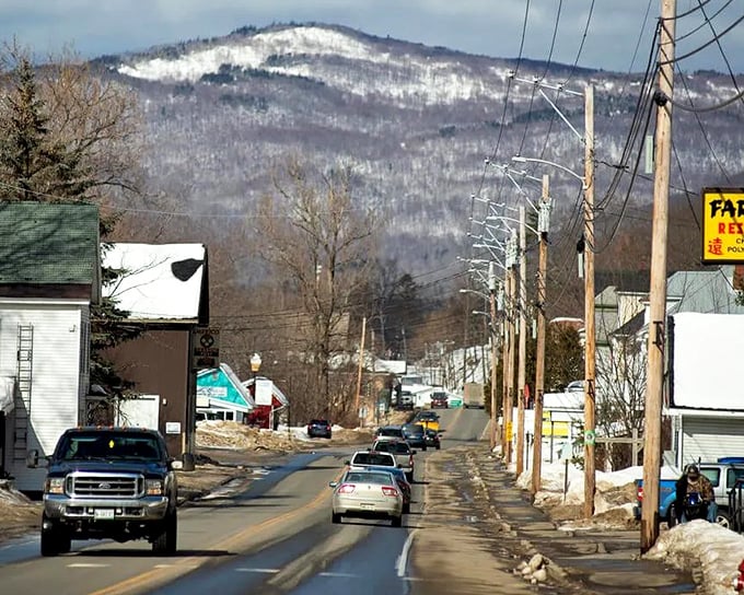 Mexico's main street in winter transforms into a snow-covered scene with mountains rising majestically in the background.