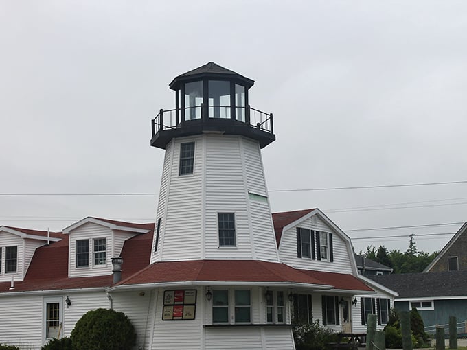 Trenton's lighthouse stands as a white sentinel against blue skies, continuing its centuries-old tradition of guiding mariners home.