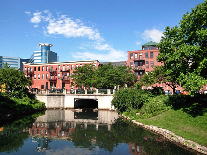 The Arcadia Creek area in Kalamazoo offers a peaceful urban waterway surrounded by restored brick buildings.