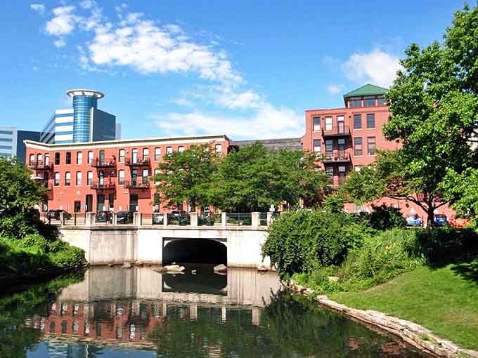 The historic red brick mansion in Kalamazoo stands surrounded by beautiful gardens, a testament to the city's rich architectural heritage.