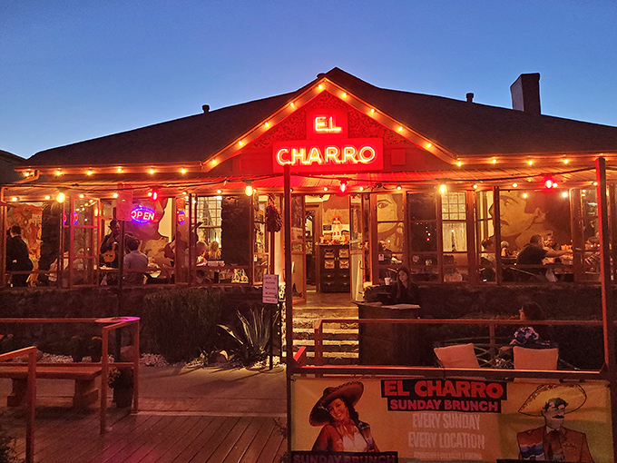 El Charro Cafe lights up the night with its warm glow and festive atmosphere, drawing diners to this historic Tucson landmark.