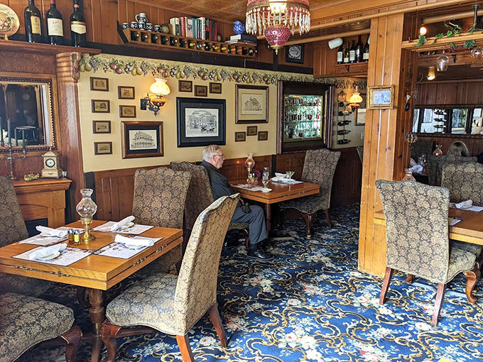 Step into yesterday's elegance with plush chairs, wooden wainscoting, and floral carpeting that whispers tales of dinners past.