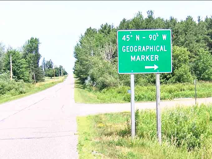 The unassuming green highway sign points the way to geographical greatness, standing sentinel along a quiet Wisconsin country road.