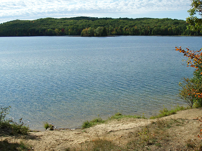 Avery Lake stretches out like a mirror, reflecting Michigan's northern sky in a display that makes painters jealous.