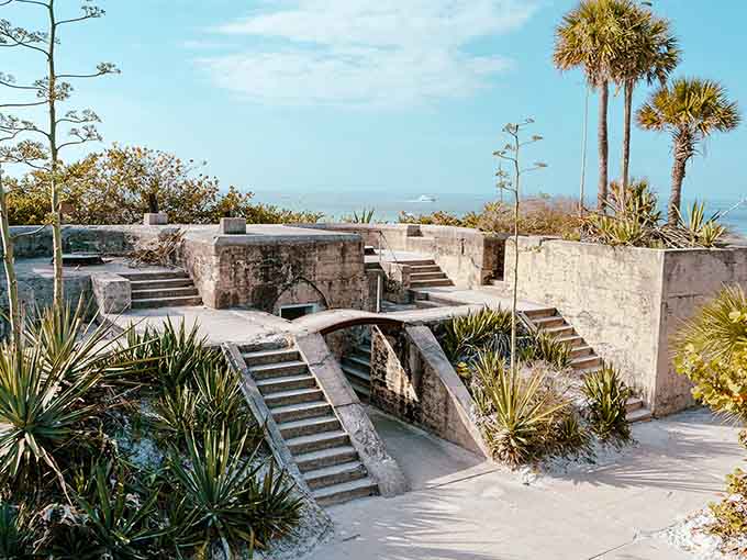 The concrete ruins of Fort Dade create an otherworldly landscape where military history meets tropical paradise, like someone built a fortress and nature said "hold my beer."