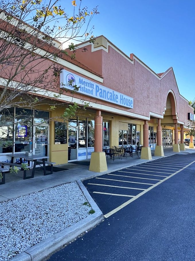 The pink-hued exterior of Merritt Island Pancake House promises breakfast adventures beyond your wildest morning dreams – pancake paradise hiding in plain sight.