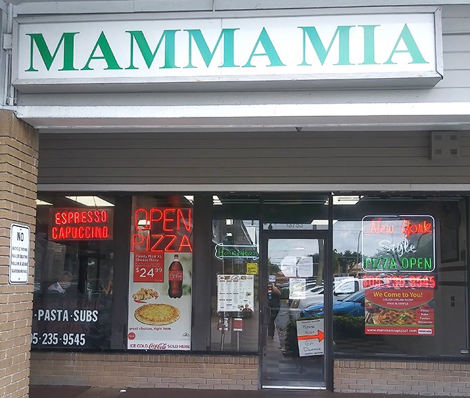 The iconic green "MAMMA MIA" sign beckons hungry patrons like a lighthouse for carb-seekers in a sea of Miami dining options.
