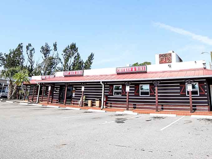 That distinctive pink roof and rustic exterior are your first clue that serious barbecue business happens here daily.