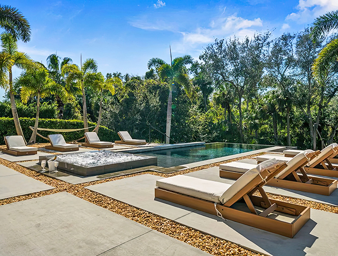Poolside paradise where lounge chairs invite lazy afternoons and the infinity edge blurs the line between water and sky.