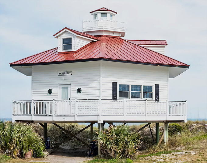Standing proud with its distinctive red roof and white clapboard siding, Katie's Light beckons travelers seeking a truly unique beachfront escape.