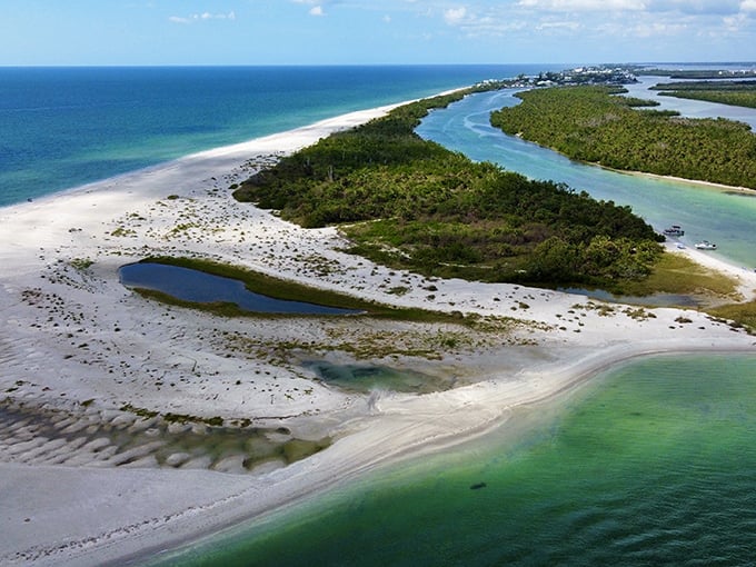 Nature's masterpiece: Where emerald waters meet pristine shorelines at Stump Pass Beach State Park's breathtaking aerial view.