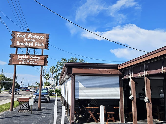 That iconic wooden sign beckons like a smoky siren call &ndash; promising fishy treasures that'll make your taste buds dance with joy!