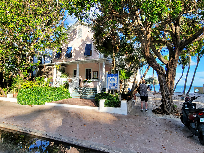 The charming Victorian facade of Louie's Backyard welcomes you like an old friend, promising culinary adventures with that million-dollar ocean view just steps away.